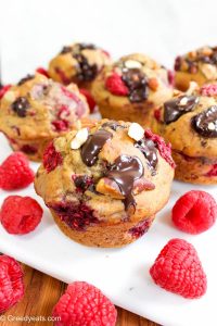 Healthy raspberry muffins with chocolate chunks, banana and almonds